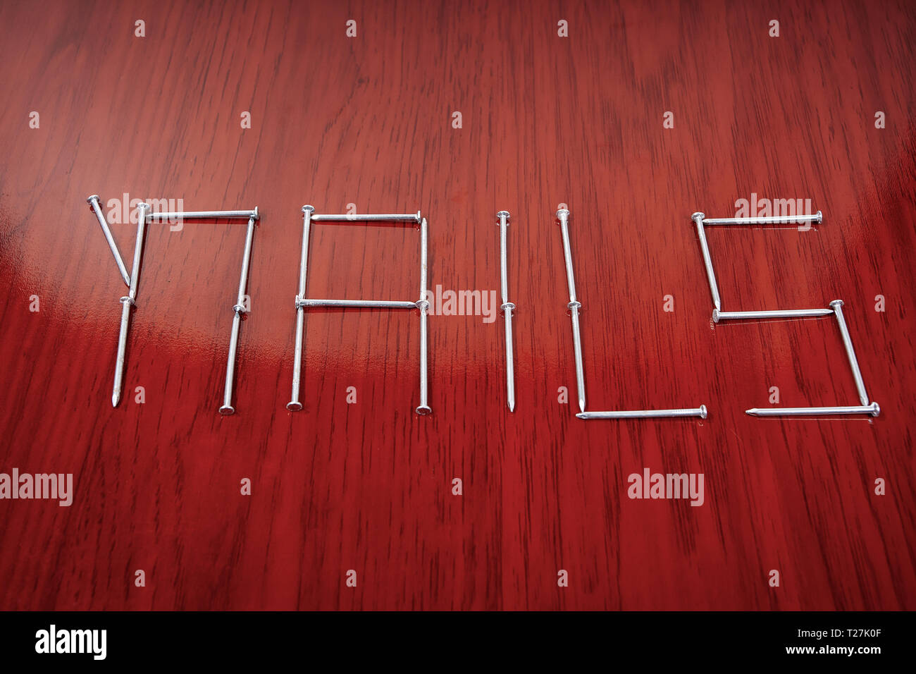 An organized group of nails forming the word nails Stock Photo - Alamy