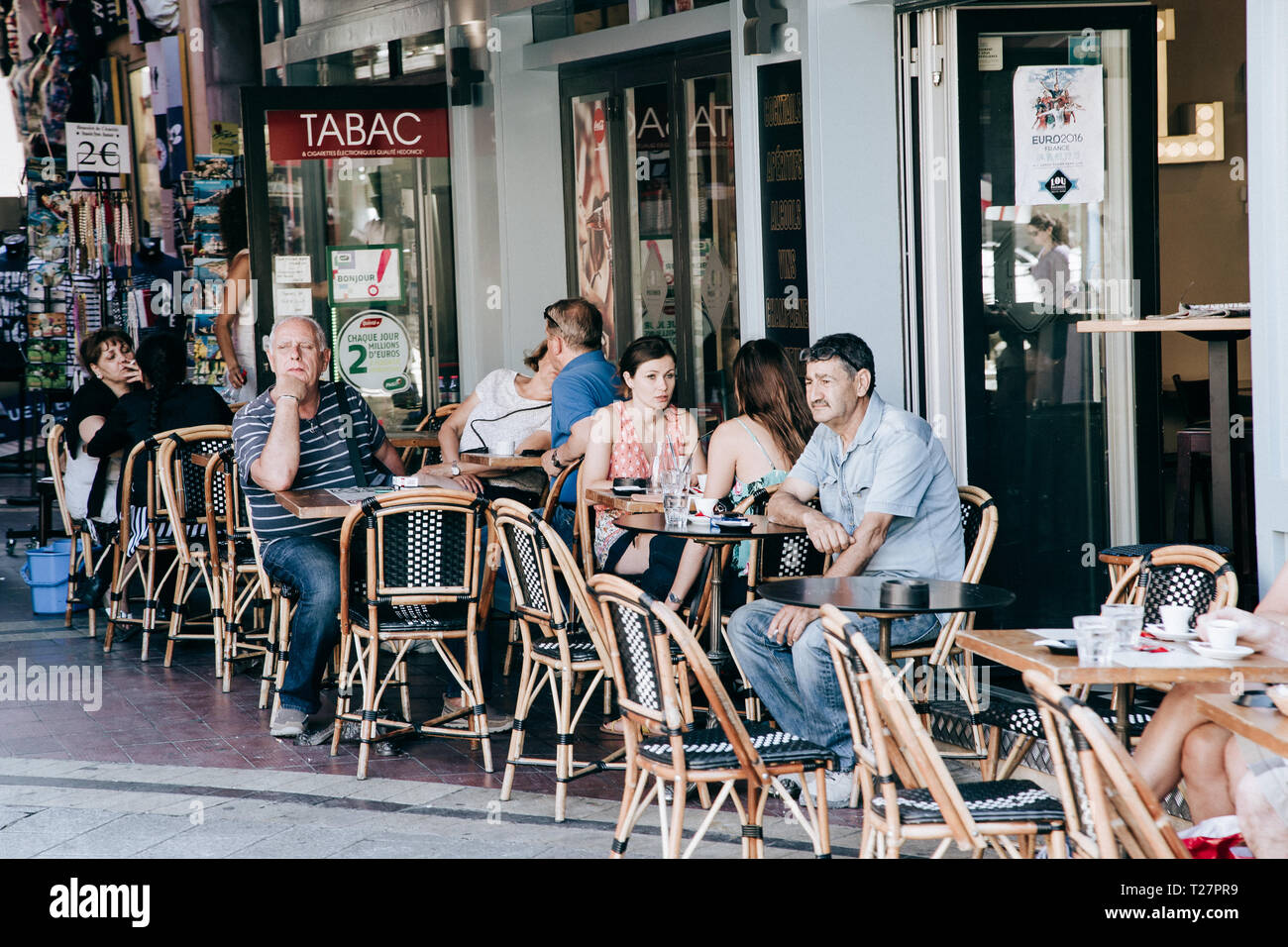 Nice, France. Customers outside a cafe enjoying a conversation Stock ...