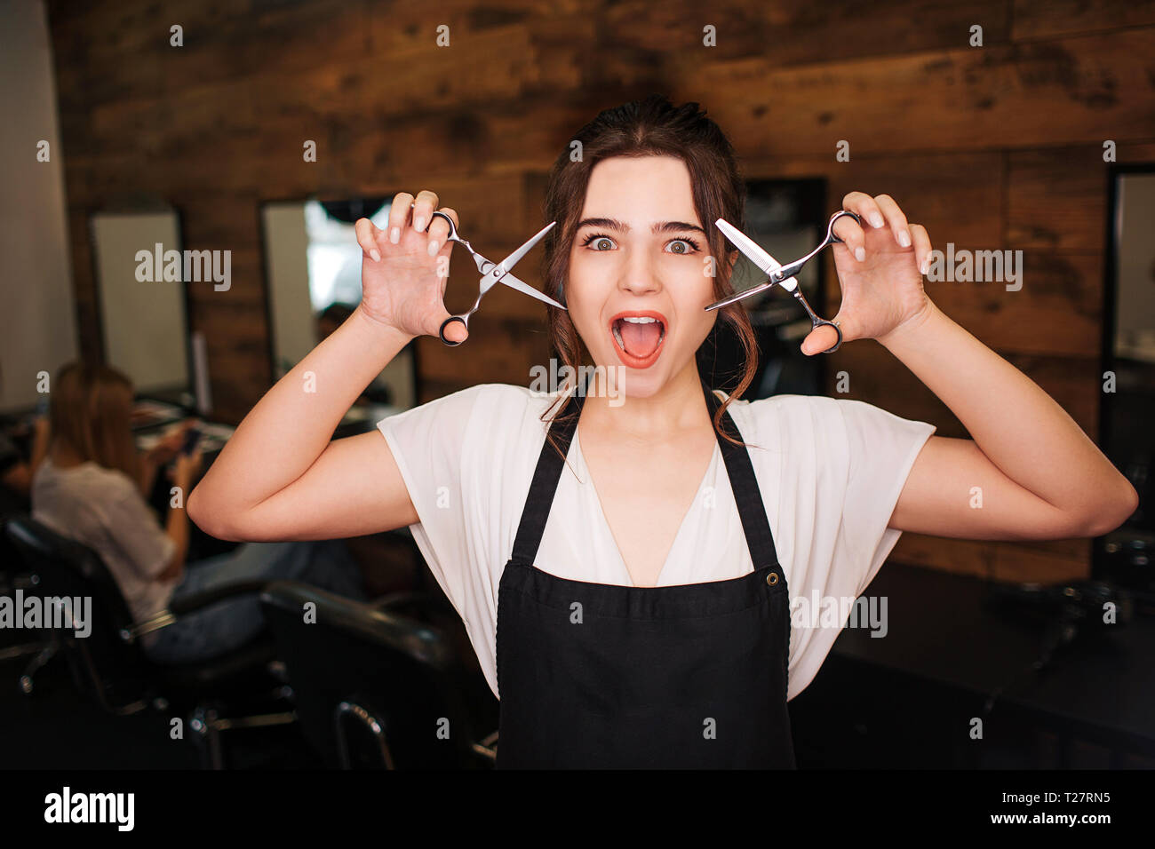 Black stylist apron hi-res stock photography and images - Alamy