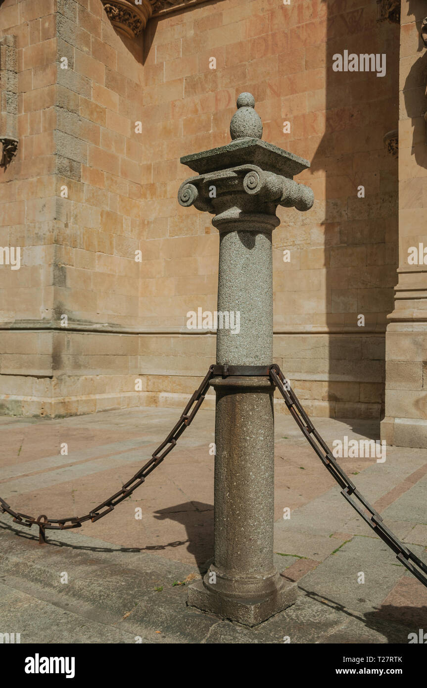 Close-up of pillar for iron chains support finely carved in stone at ...