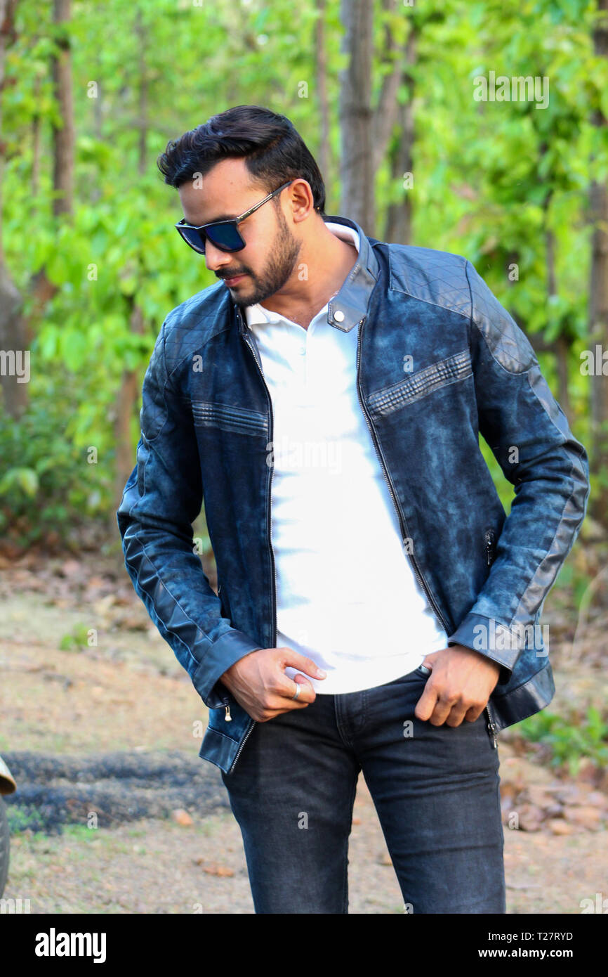 handsome model standing in a lovely pose Stock Photo - Alamy