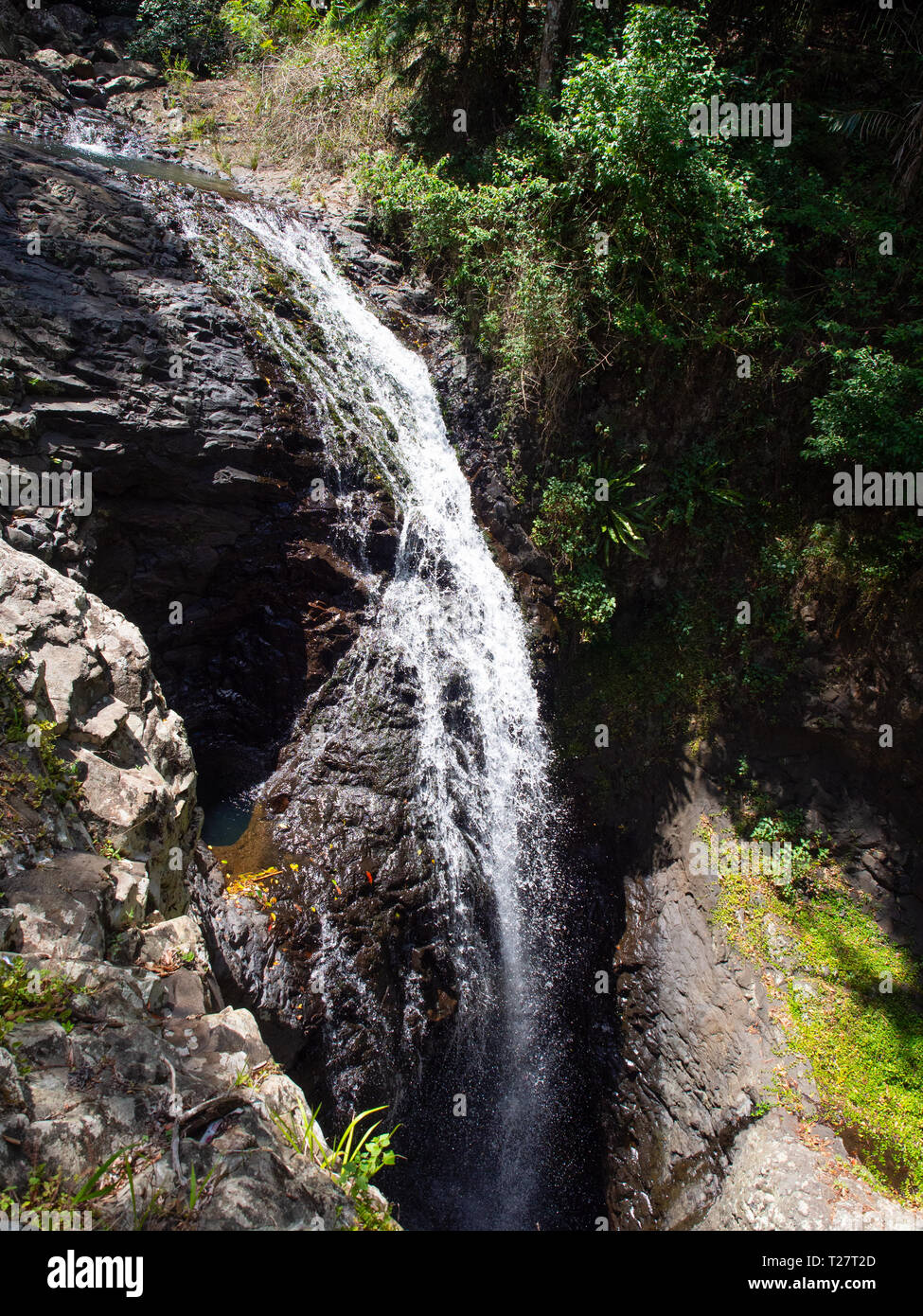 Small Waterfall Flowing Over Rocks Stock Photo - Alamy
