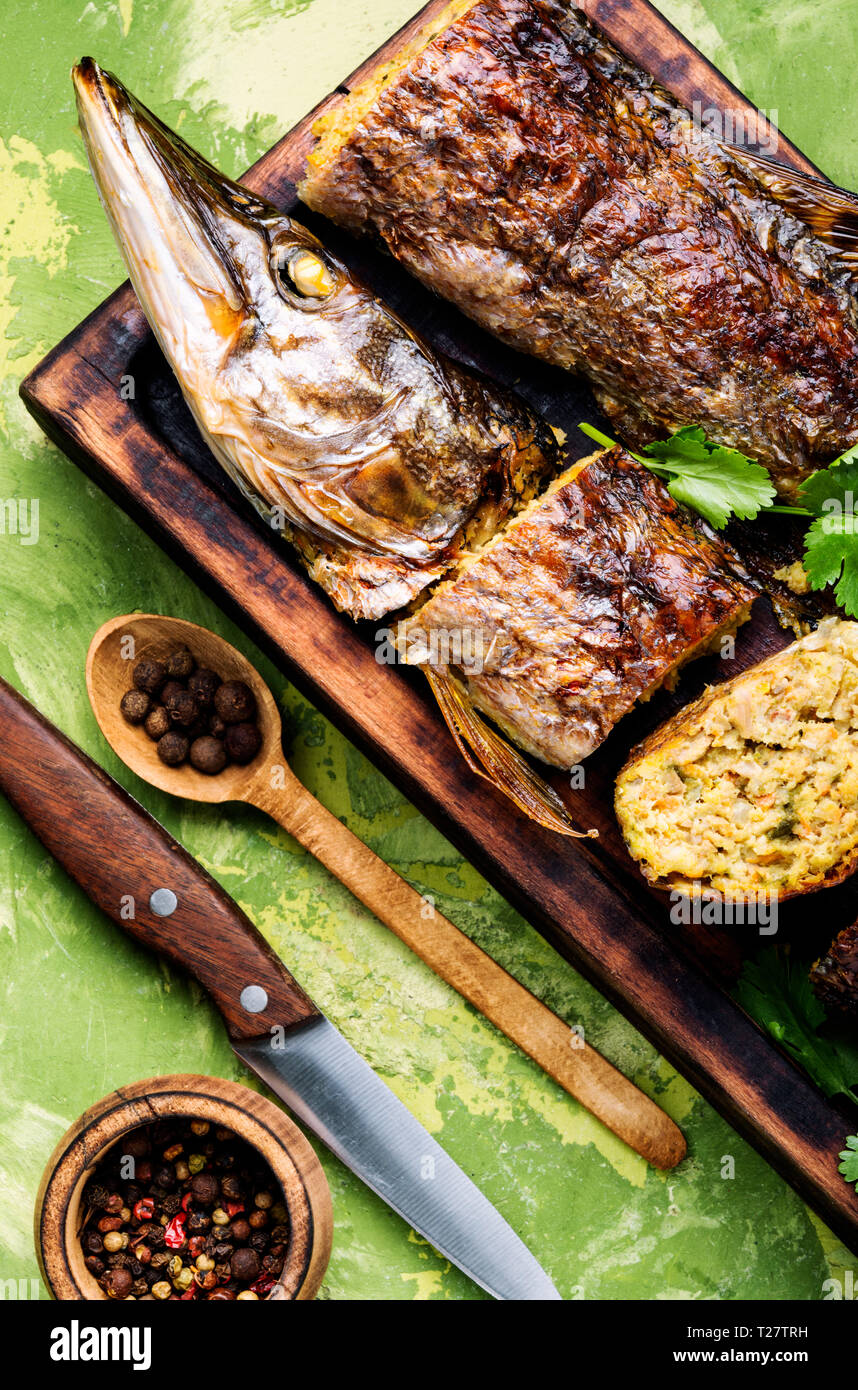 Baked grilled fish.Pike fish stuffed with mushrooms.Pike royally ...