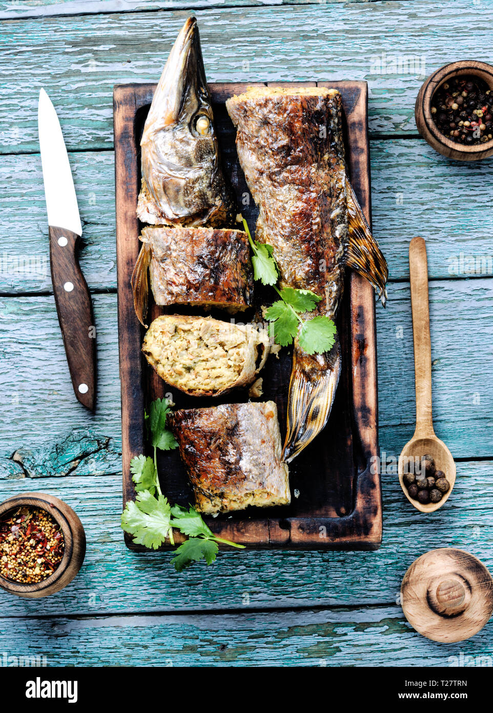 Baked grilled fish.Pike fish stuffed with mushrooms.Pike royally ...