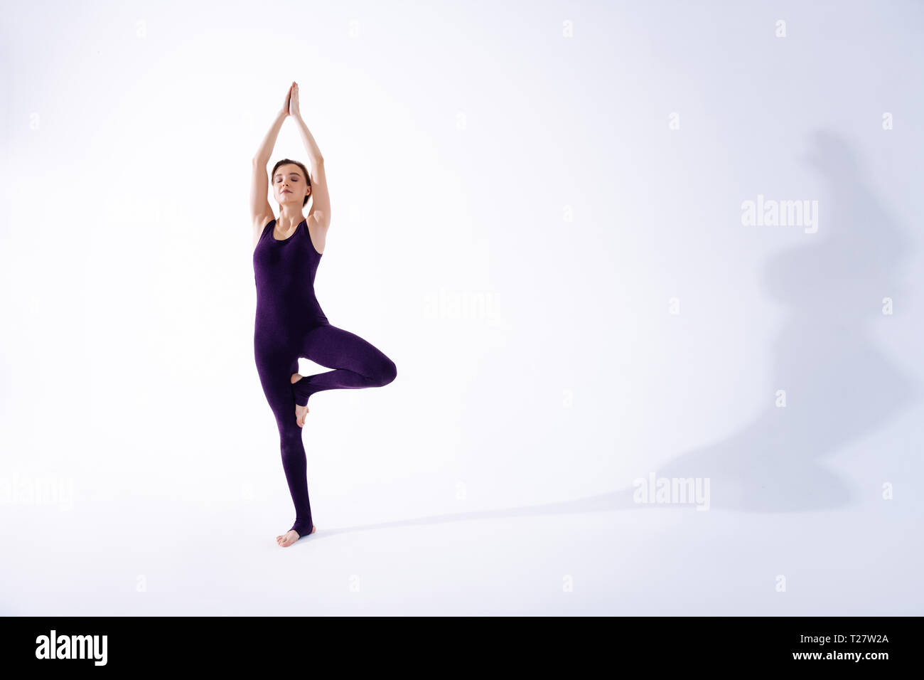 Beautiful young woman holding her hands up Stock Photo - Alamy