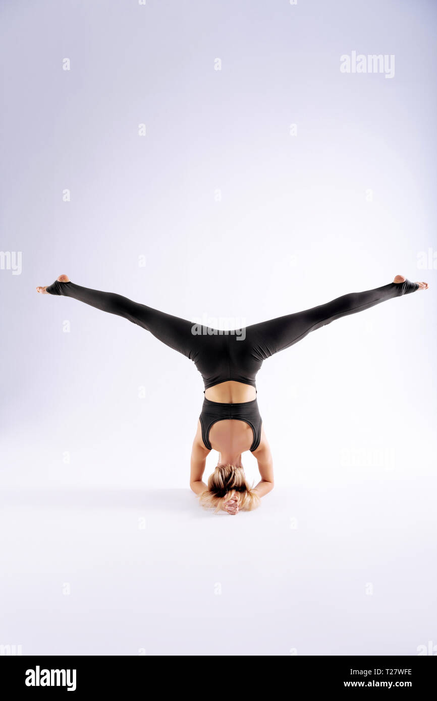 Pleasant nice woman showing the splits in the air Stock Photo - Alamy