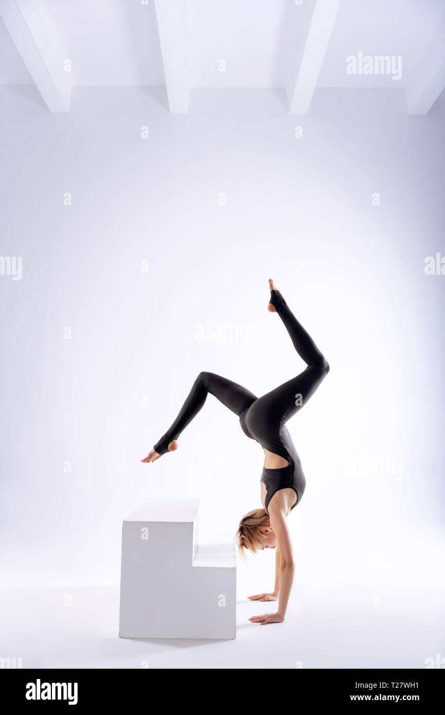 Nice good looking woman moving her legs in the air Stock Photo - Alamy