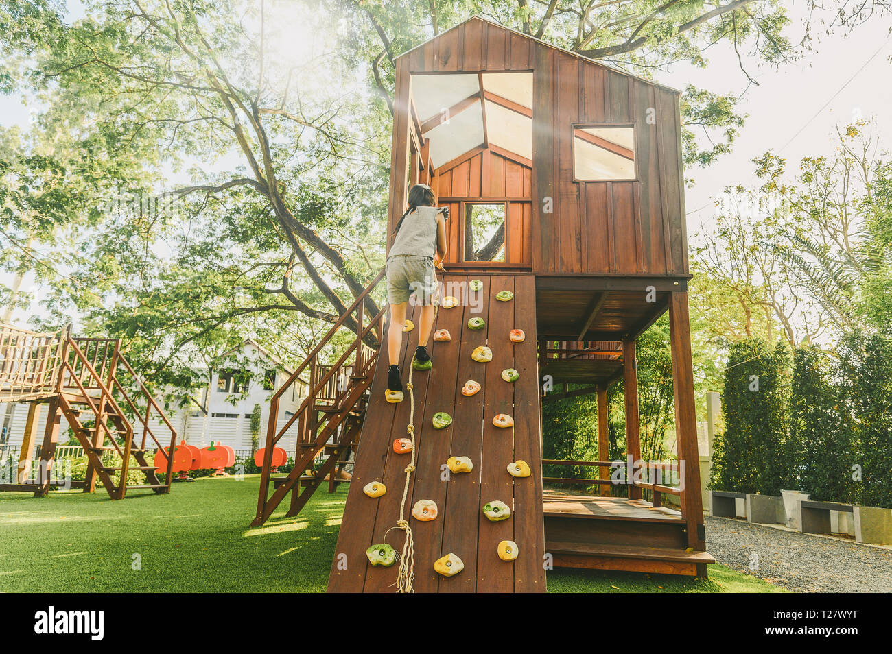 Asian kid playing at the playground Stock Photo - Alamy