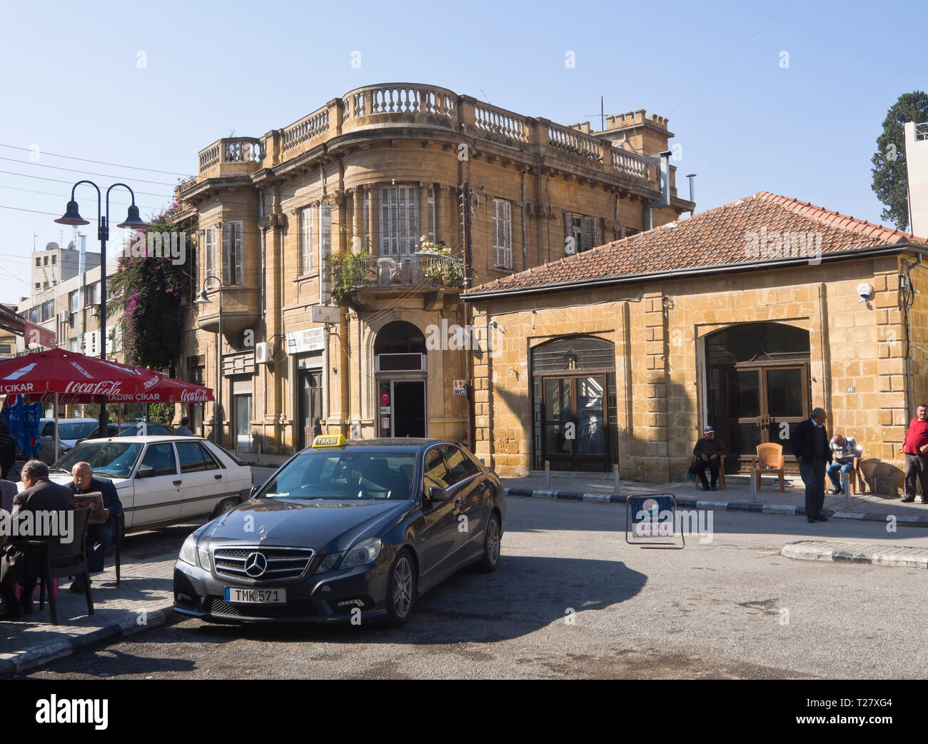 Taxi stand and colonial buildings near the Ataturk square in the ...