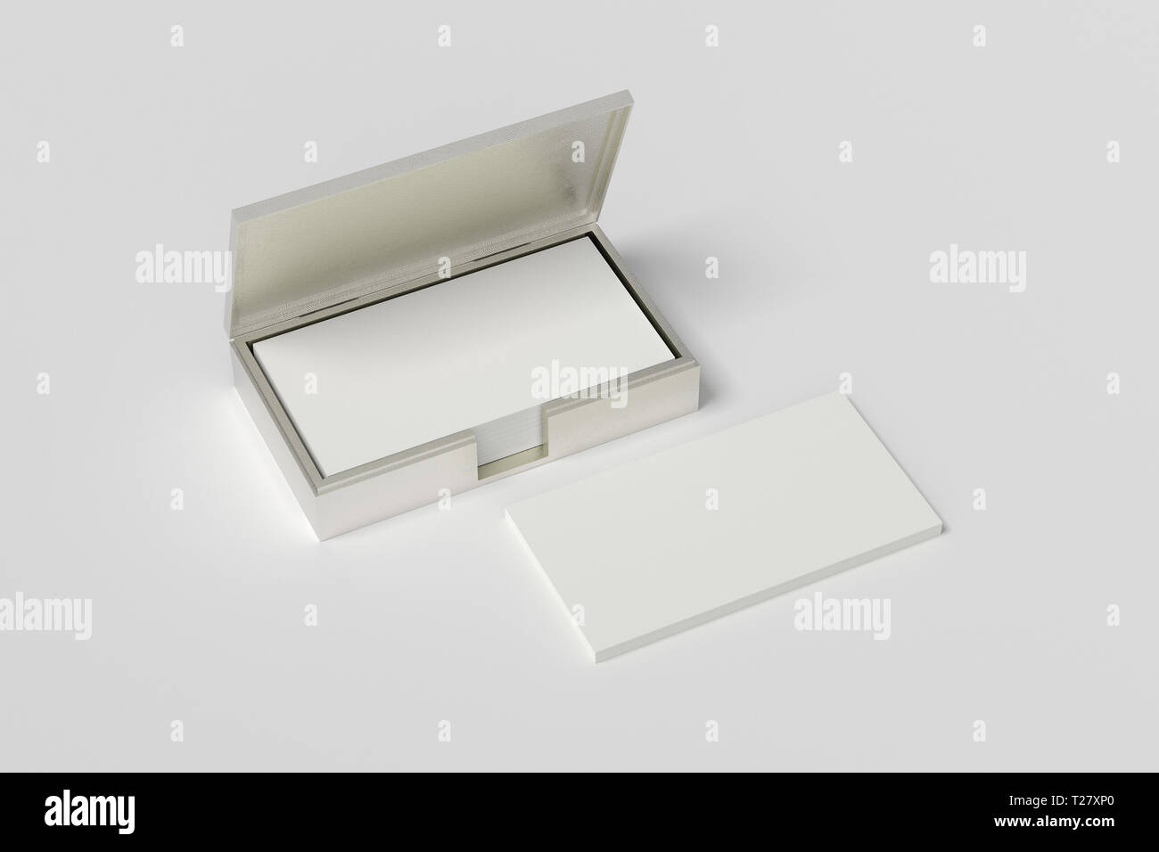 Silver business card box holder with blank business cards in stack on ...