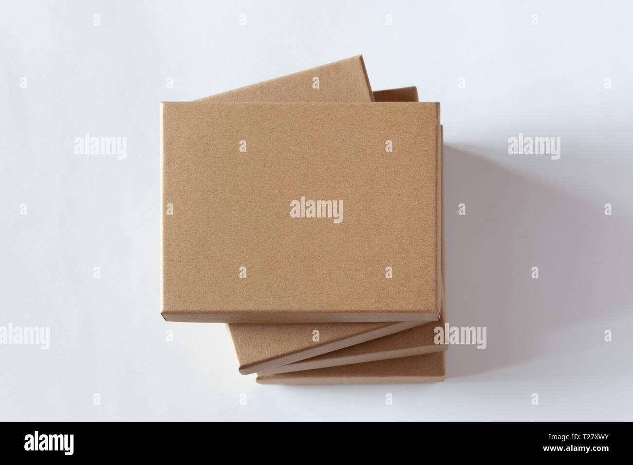 Stack of four blank closed carton boxes packaging isolated on white ...
