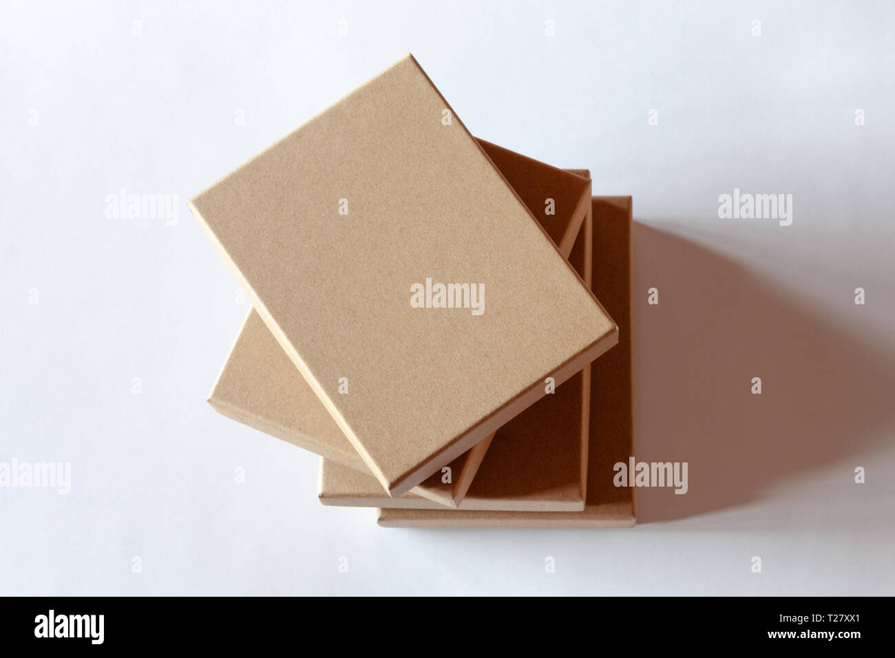 Stack of four blank closed carton boxes packaging isolated on white ...