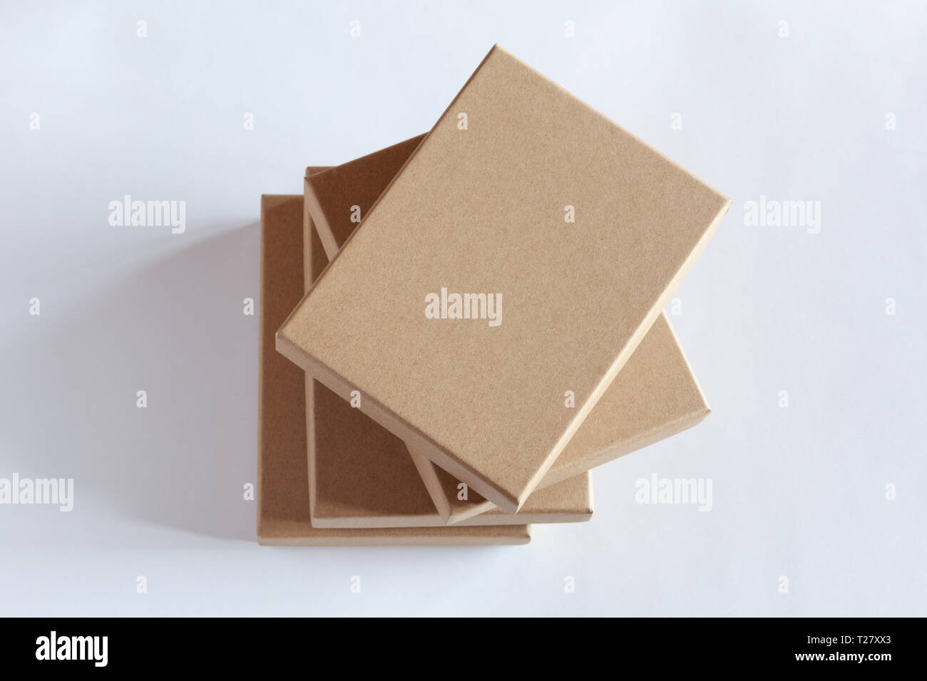 Stack of four blank closed carton boxes packaging isolated on white ...