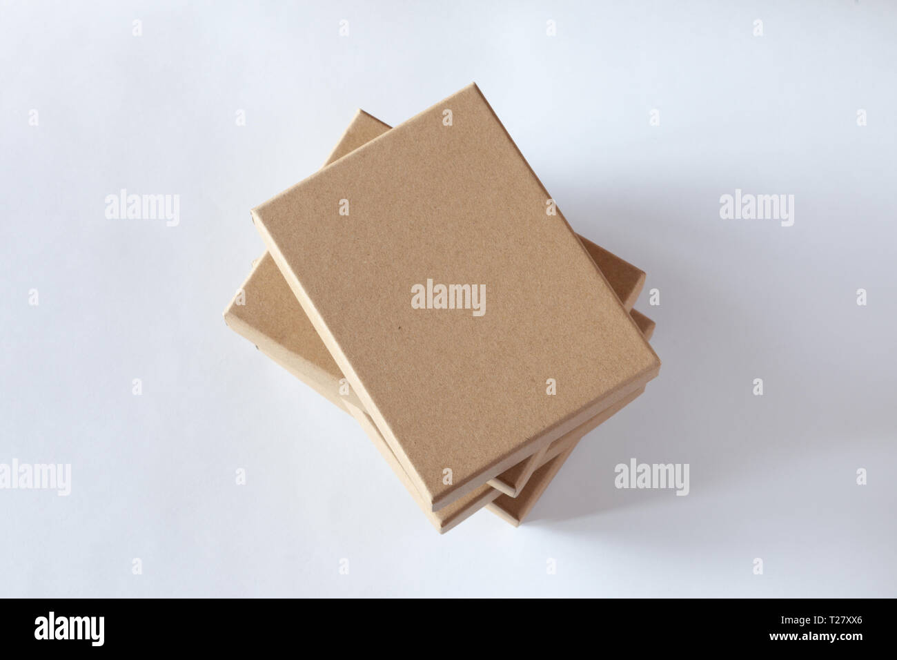 Stack of four blank closed carton boxes packaging isolated on white ...