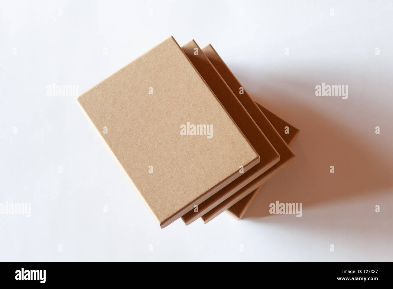 Stack of four blank closed carton boxes packaging isolated on white ...