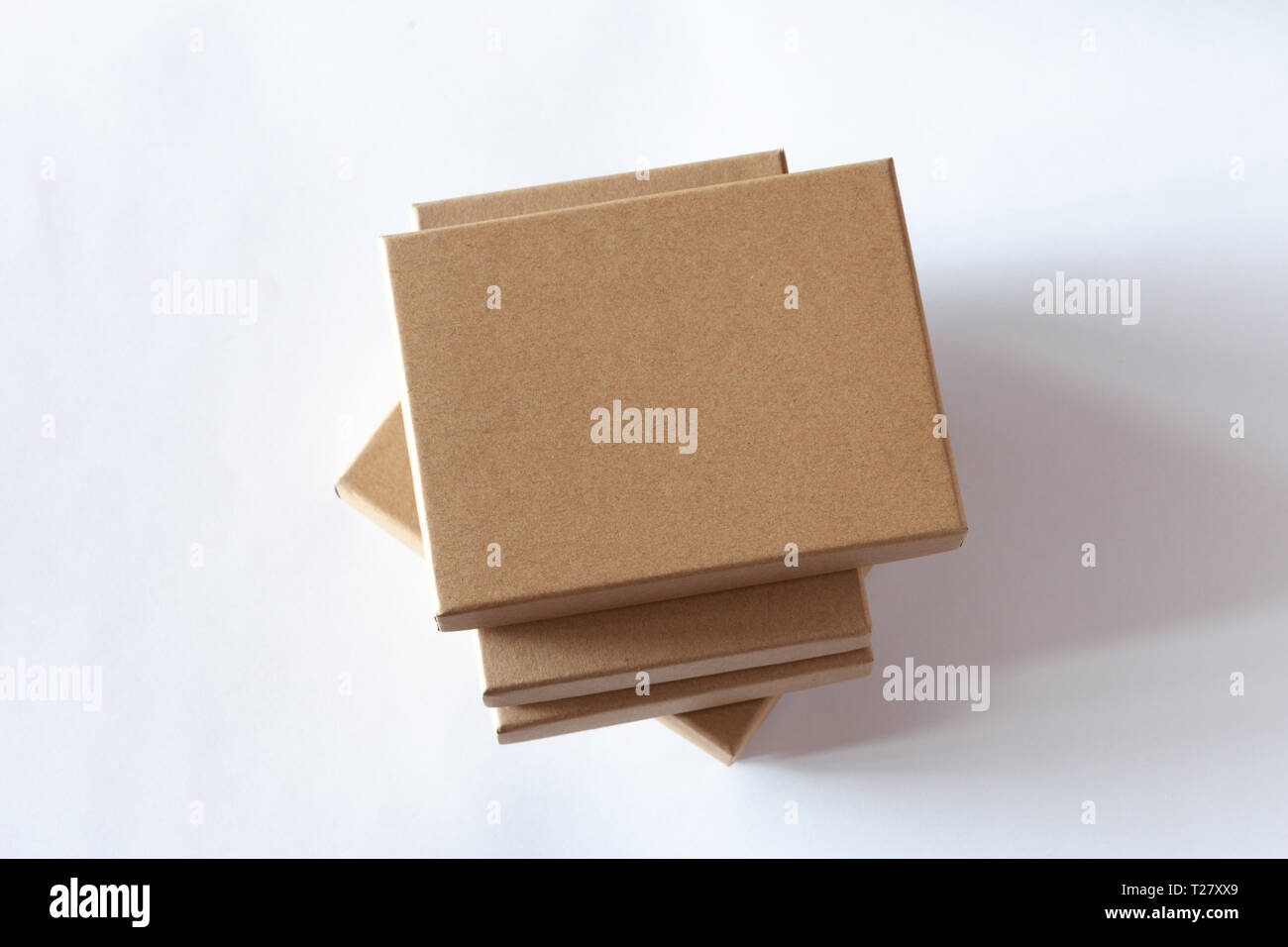 Stack of four blank closed carton boxes packaging isolated on white ...