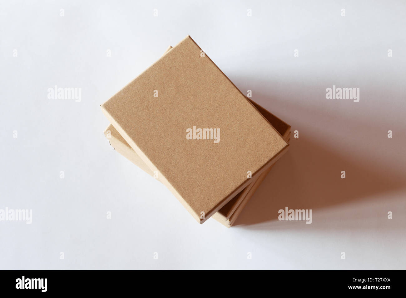 Stack of four blank closed carton boxes packaging isolated on white ...