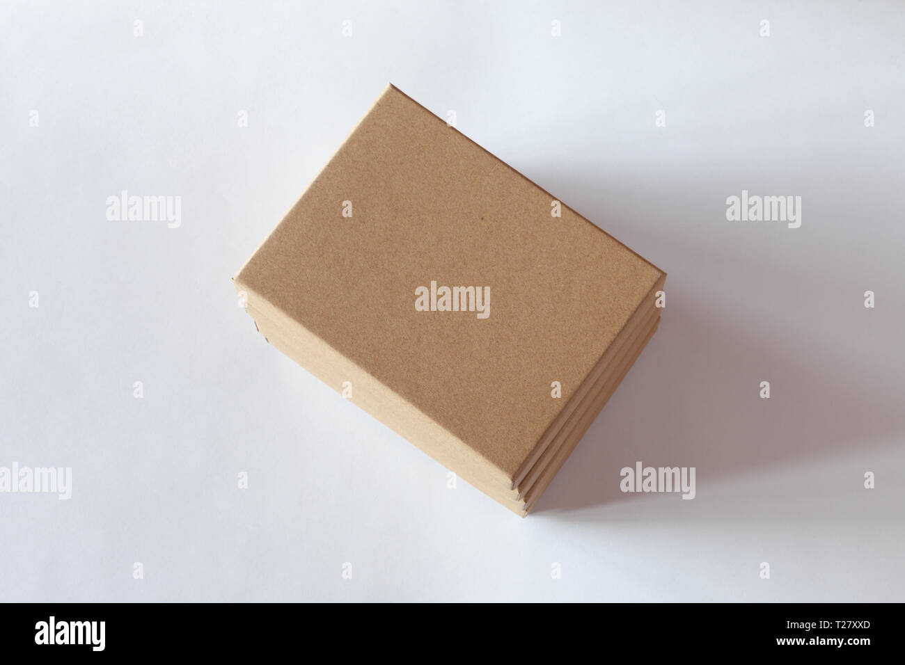 Stack of four blank closed carton boxes packaging isolated on white ...