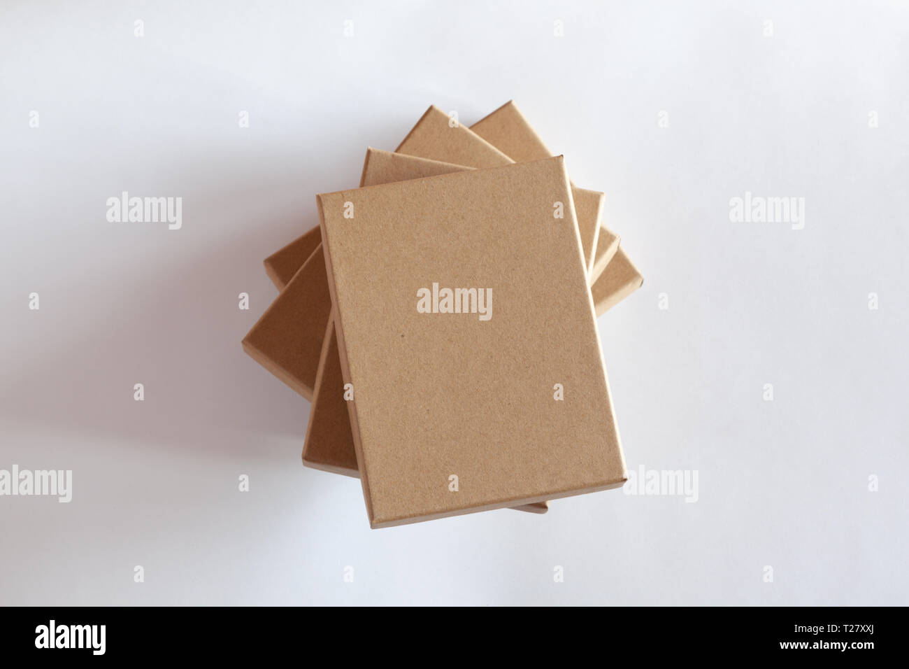 Stack of four blank closed carton boxes packaging isolated on white ...