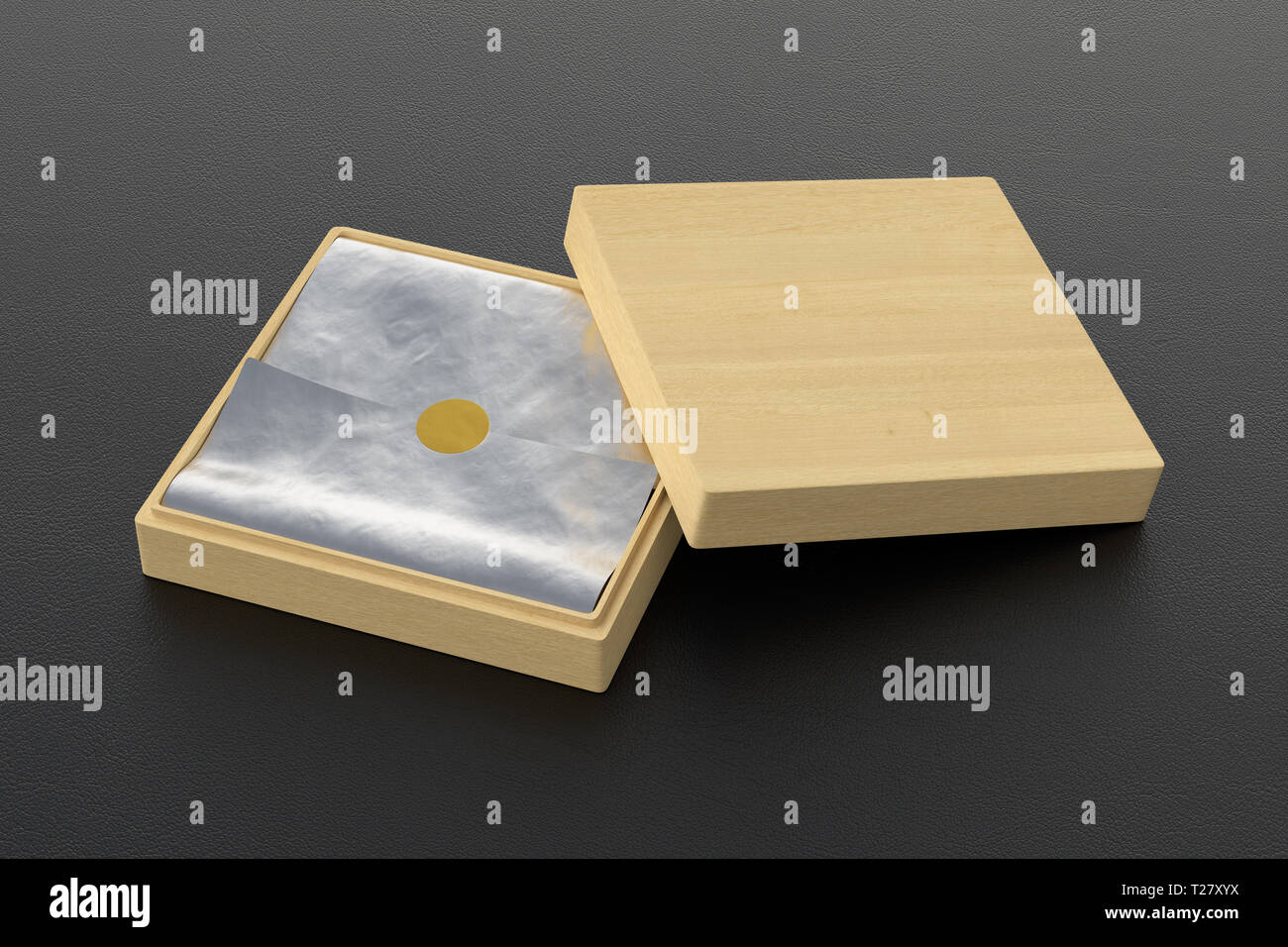 Flat open wooden square box with silver wrapping paper on black ...