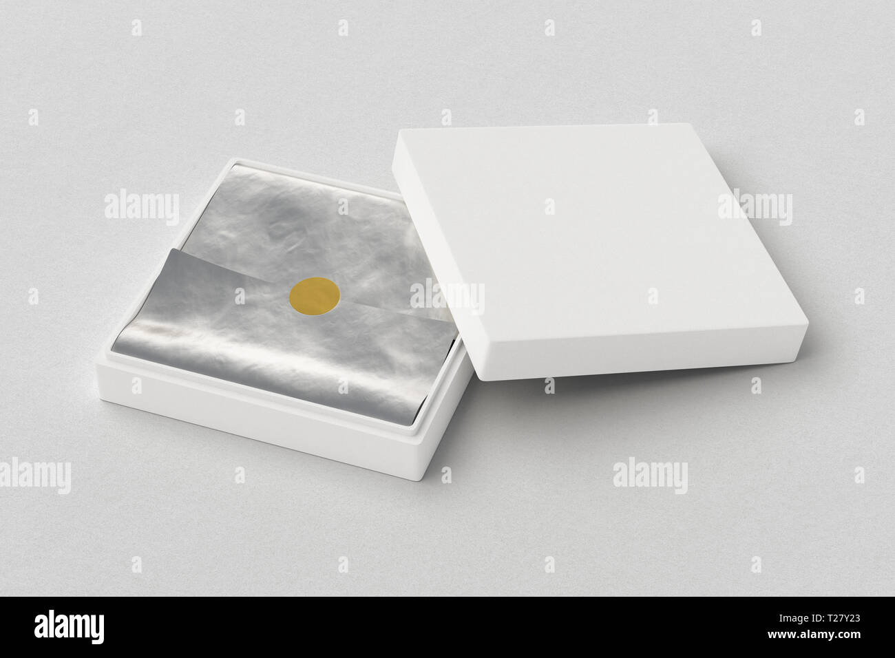 Flat open white square box with silver wrapping paper on white ...