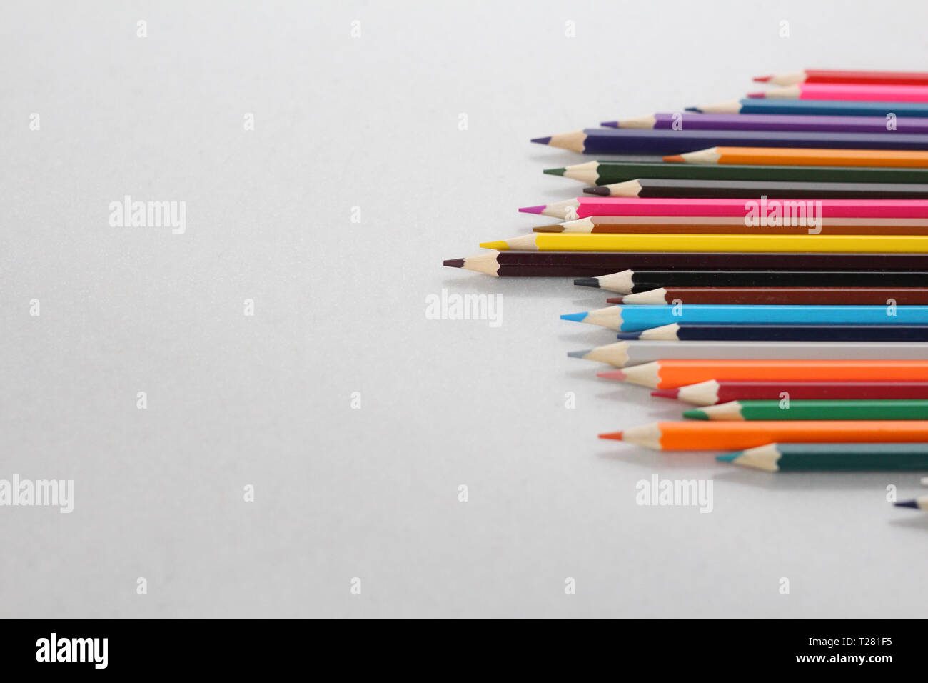 Color pencils for schoolchildren and students. Pencils are scattered on ...