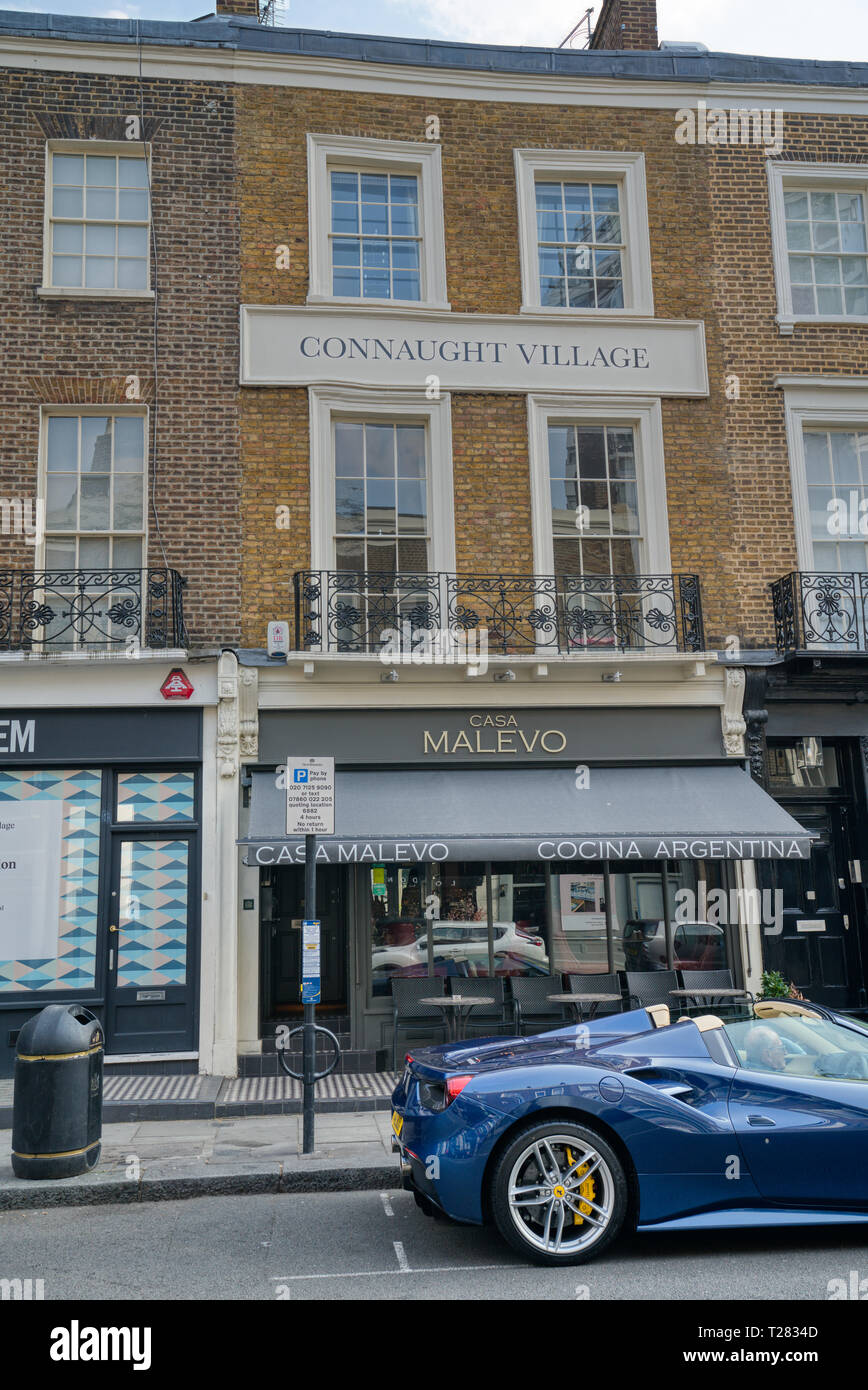 Connaught Village - Hyde Park Estate's luxury retail quarter on a sunny ...