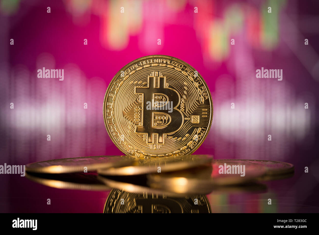 Bitcoin physical coin symbol with downtrend price graph background ...