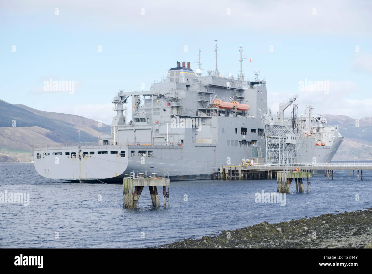 Grey battleship American and British royal fleet docked at naval base ...