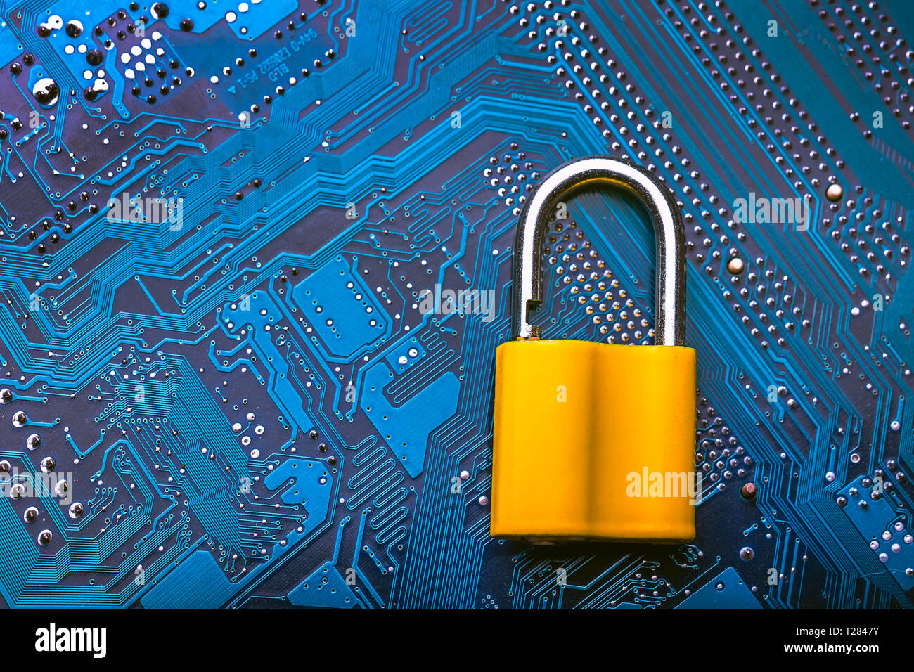 Background image of metal lock on a microchip Stock Photo - Alamy