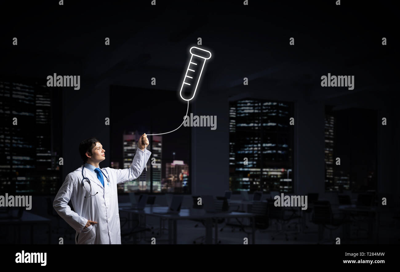 Doctor and medical vial symbol Stock Photo - Alamy