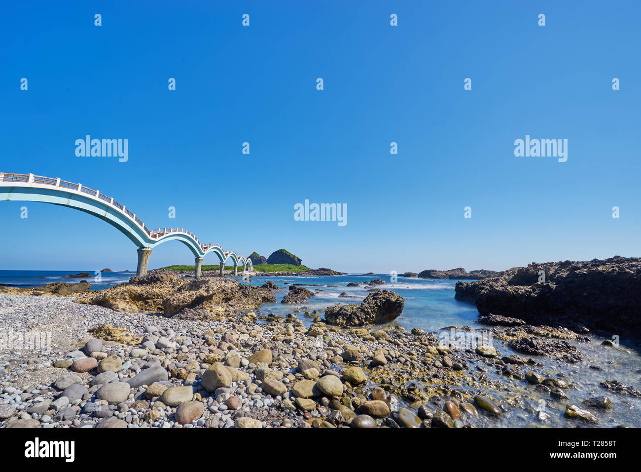 Beautiful scenic of Sanxiantai arch bridge with blue ocean with Three ...