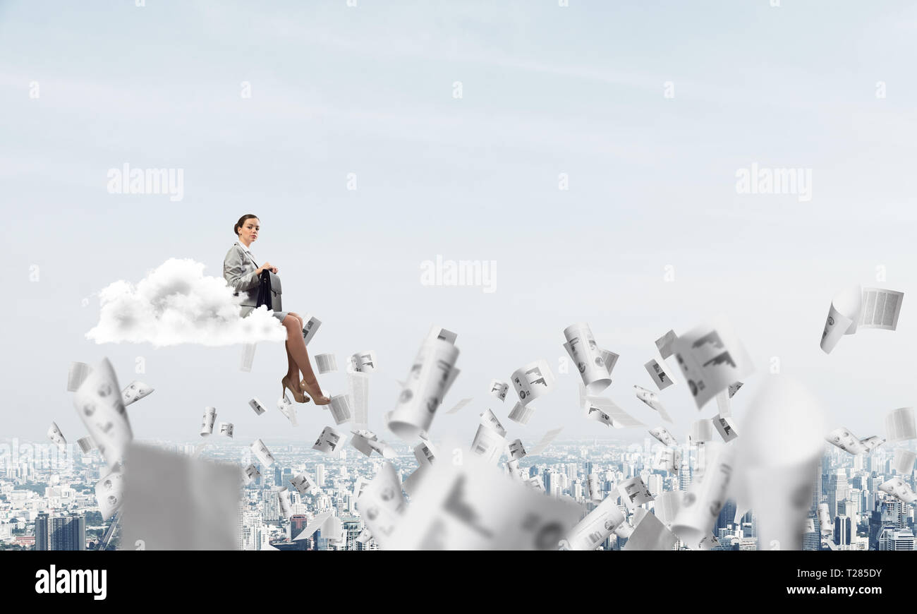 Woman float above city on cloud and papers flying around Stock Photo ...