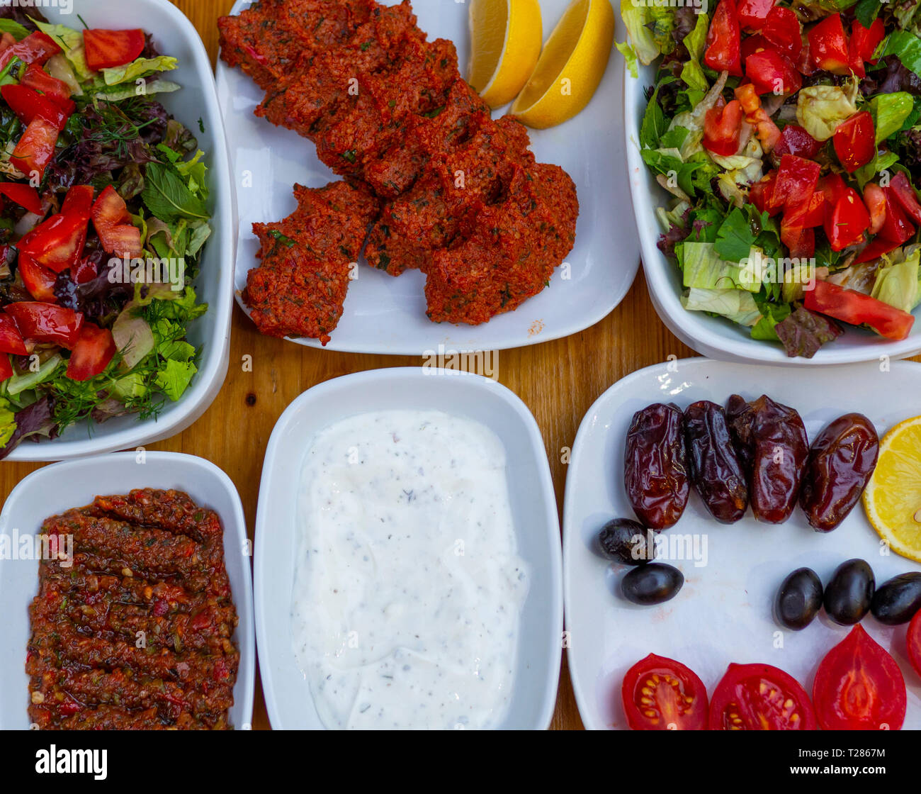 appetizer table. The background consisting of salad, yogurt, olives ...