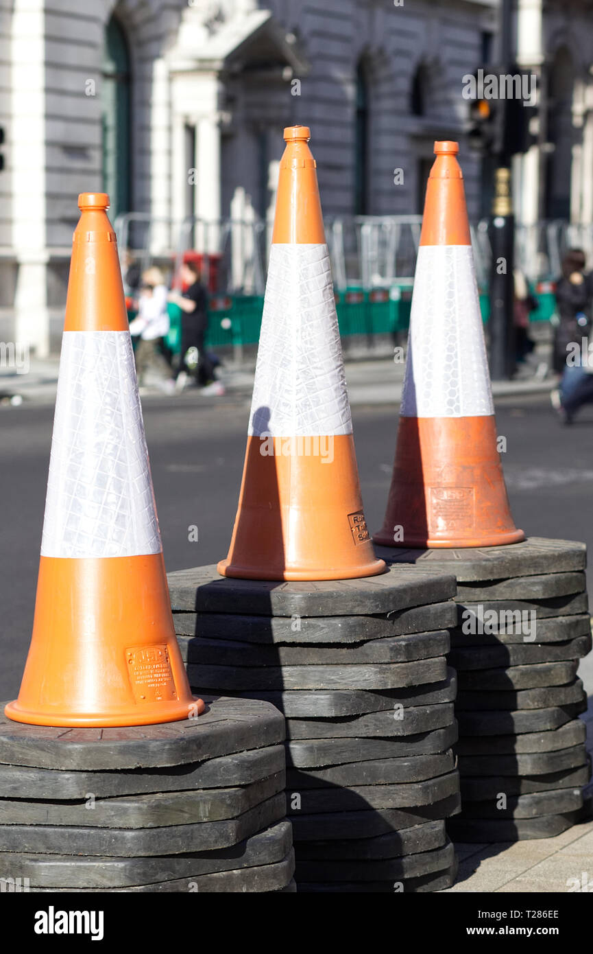 Stacked traffic cones on the roadside in London Stock Photo - Alamy