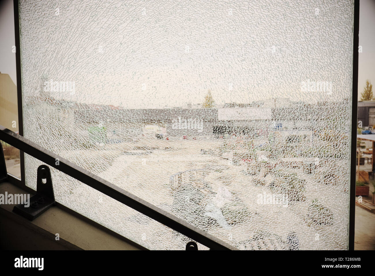 Broken smashed window pane in urban location Stock Photo - Alamy