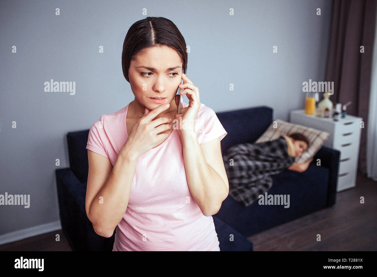 Sick child mother phone hi-res stock photography and images - Alamy