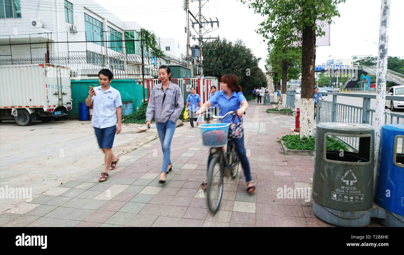 Shenzhen, China: Female workers walk on the streets after work Stock ...