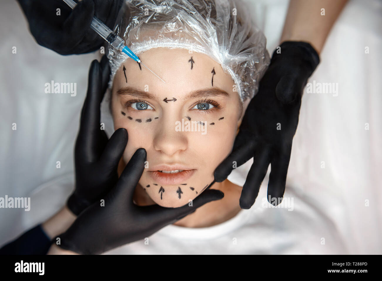 Calm peaceful young woman lying on couch and look straight forward. Her ...