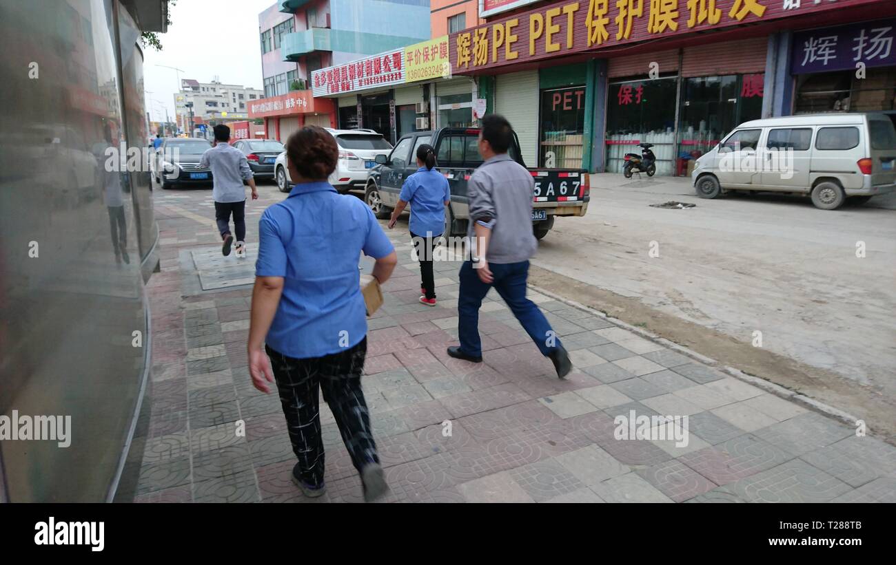 Shenzhen, China: Female workers walk on the streets after work Stock ...