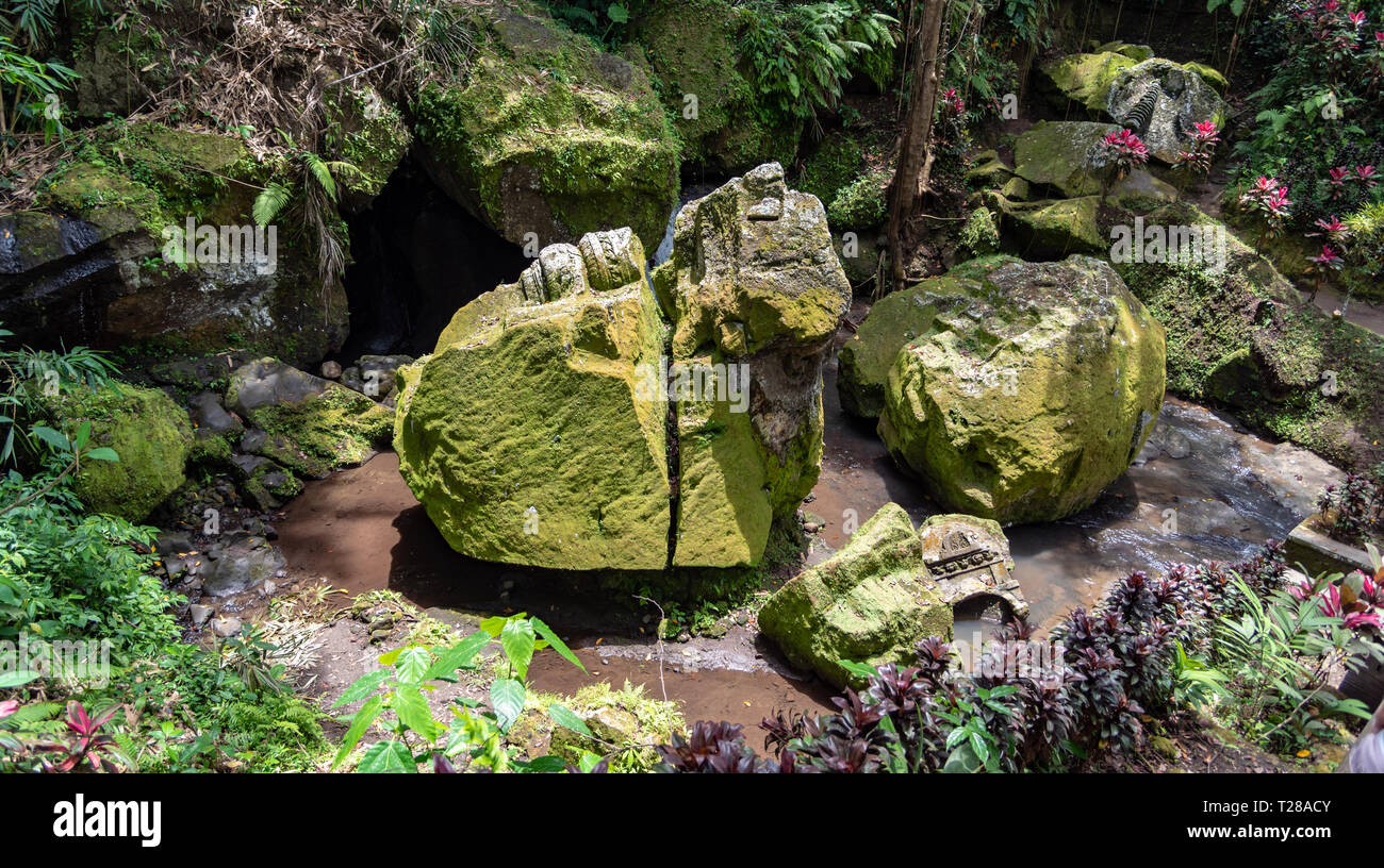 Ancient stone carvings at Goa Gajah Sanctuary Ubud, Bali, Indonesia ...