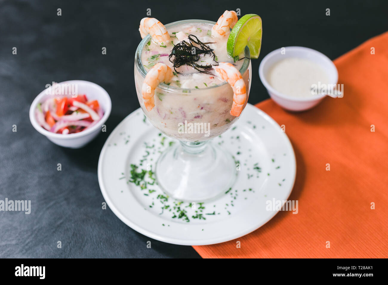 Tiger milk with shrimps and peruvian sauce Stock Photo - Alamy
