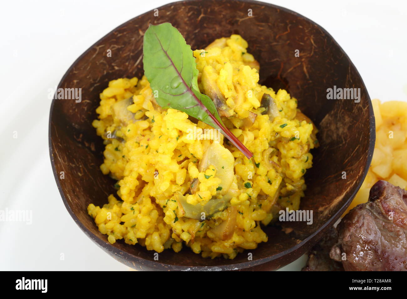 Rack of lamb with rice on a white background Stock Photo - Alamy