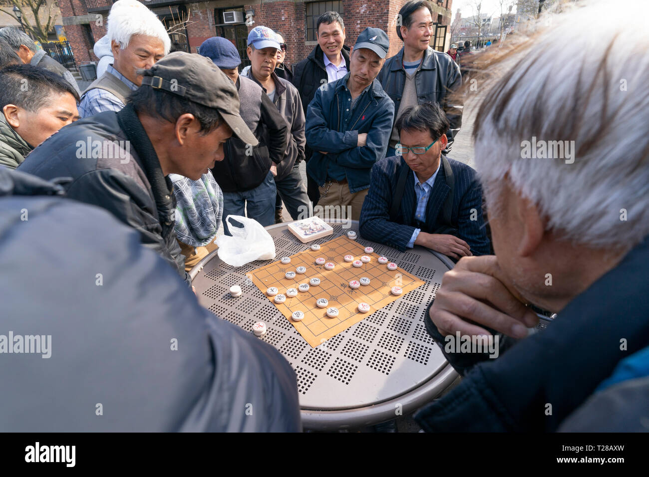 New York, NY - March 30, 2019: Chinese people playing Xiangqi also ...