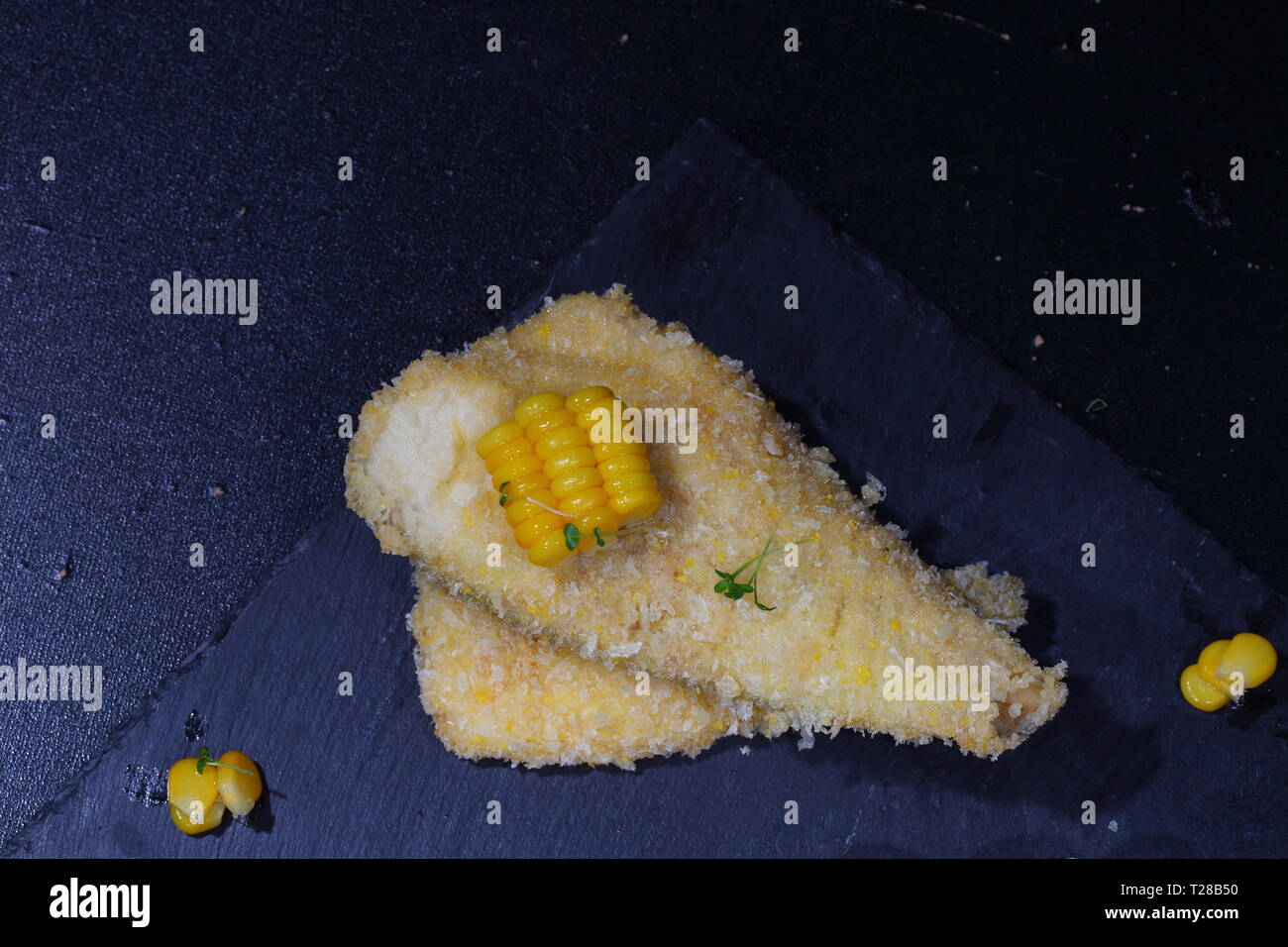 white fish breaded with coconut and bread Stock Photo - Alamy