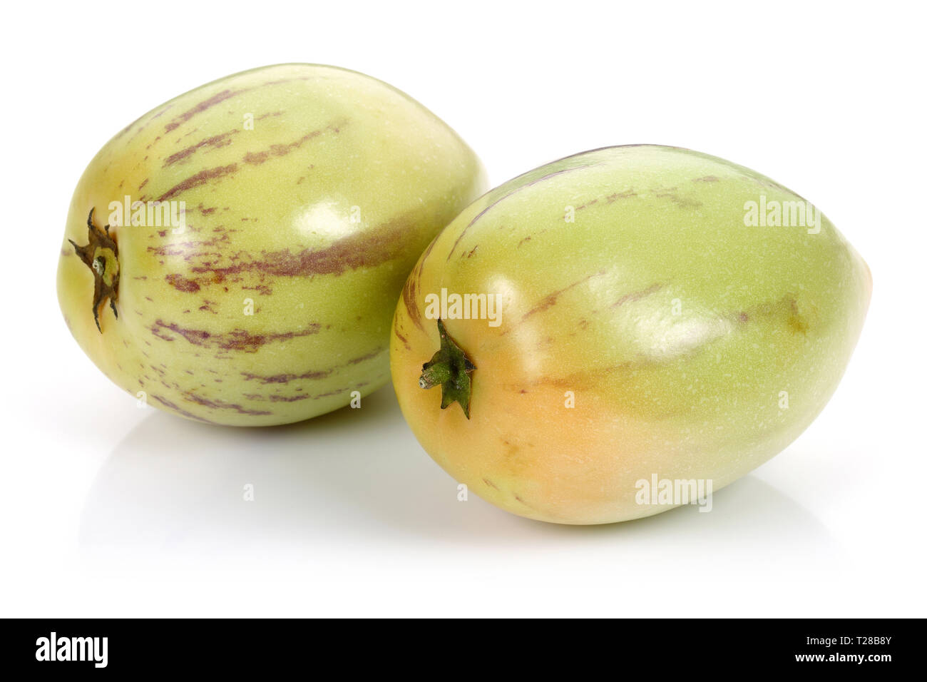Whole Pepino melon fruits isolated on white background Stock Photo - Alamy