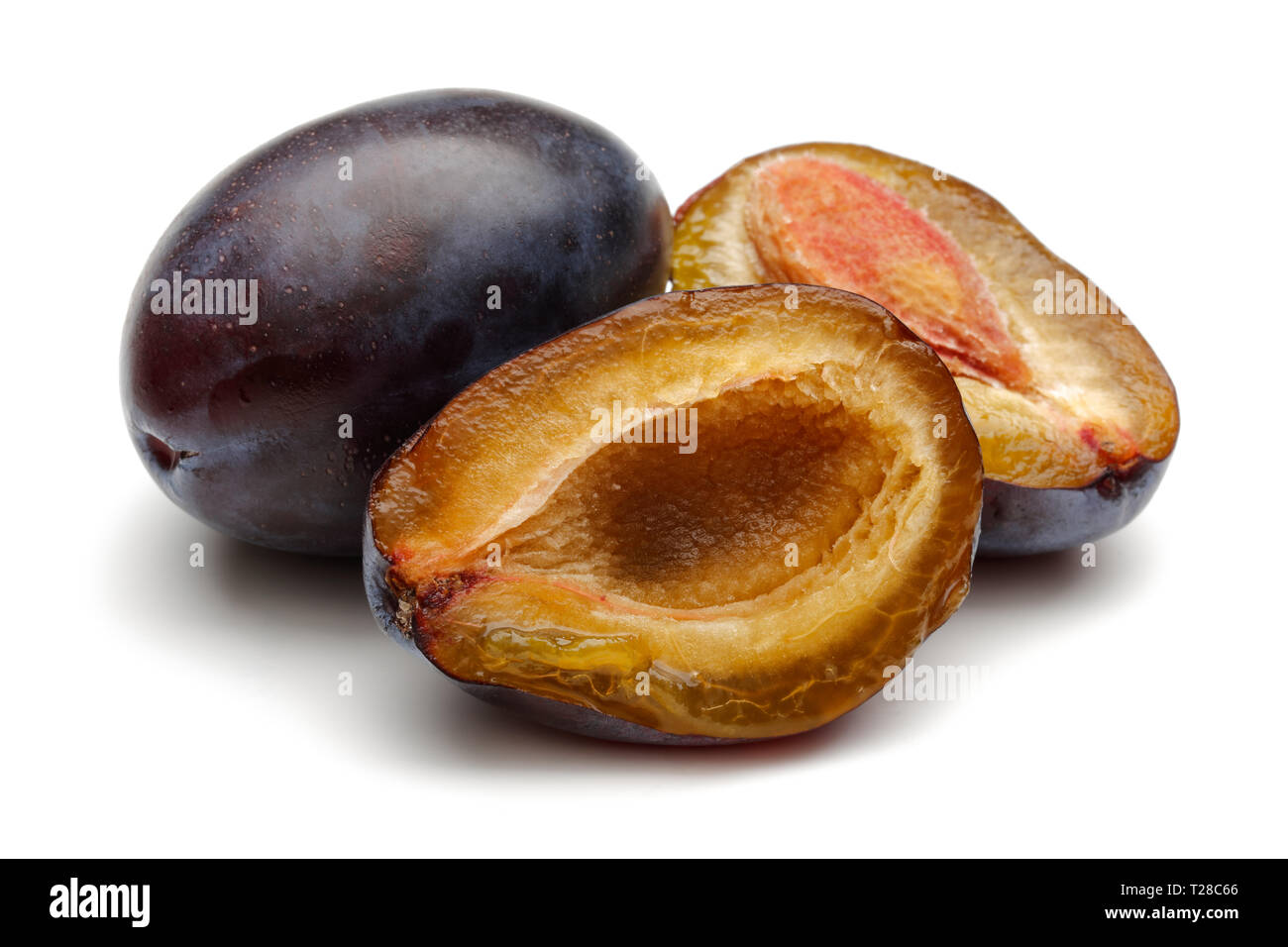 Whole and half Damson plums isolated on white background Stock Photo ...