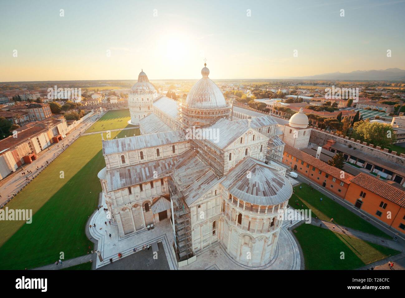 Cathedral viewed from top of Pisa leaning tower at sunset wide angle ...