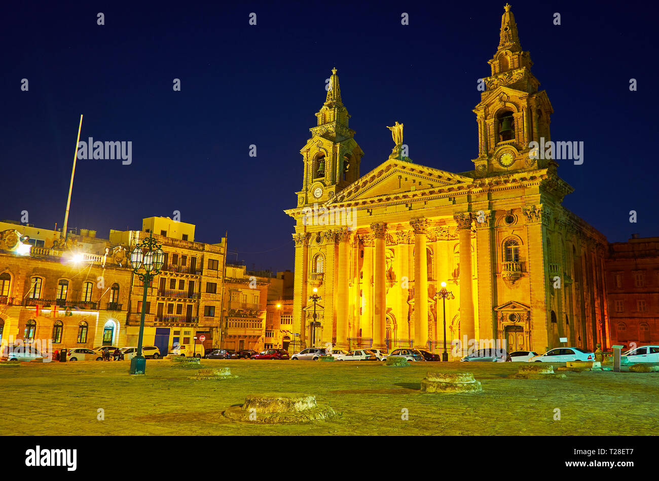 The bright evening illumination of St Publius Parish Church with ...