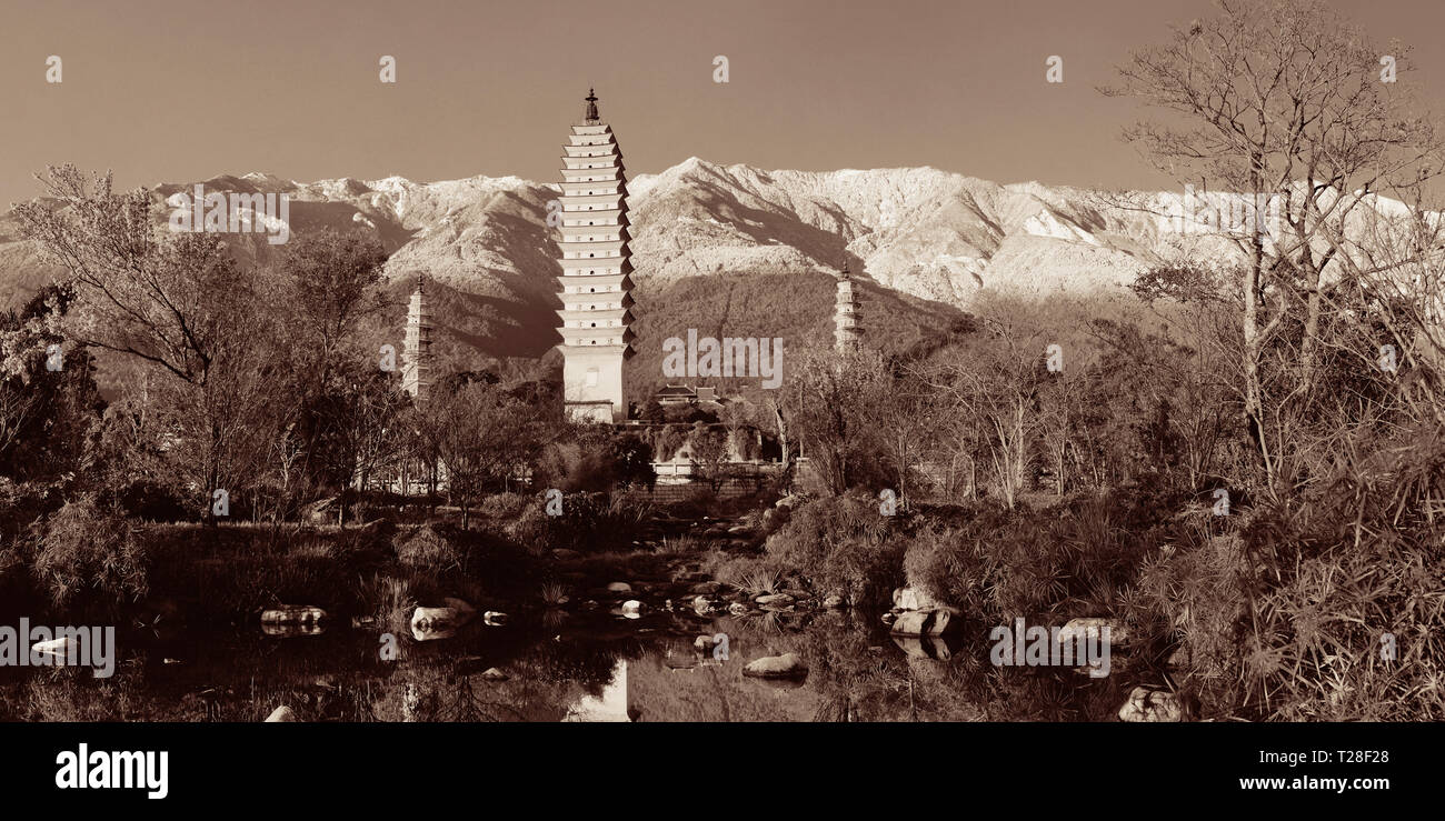 Ancient pagoda in Dali old town with snow capped Mt Cangshan, Yunnan ...